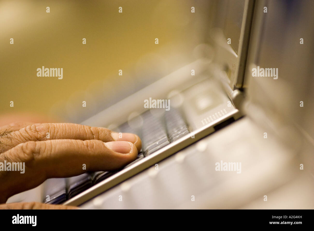 Laptops in a line with one being worked on Stock Photo - Alamy