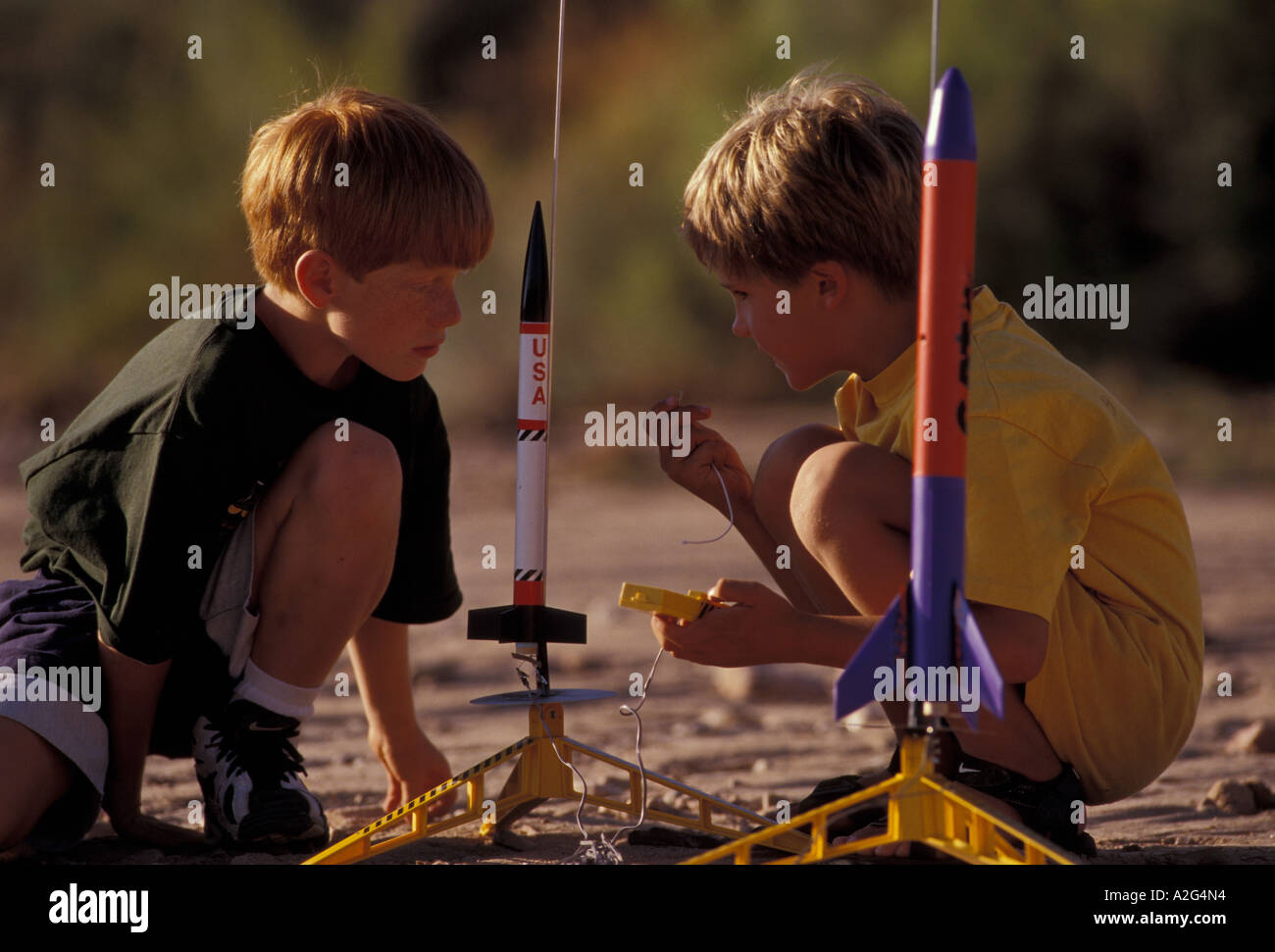 Young boys shooting model rockets, (MR Stock Photo - Alamy