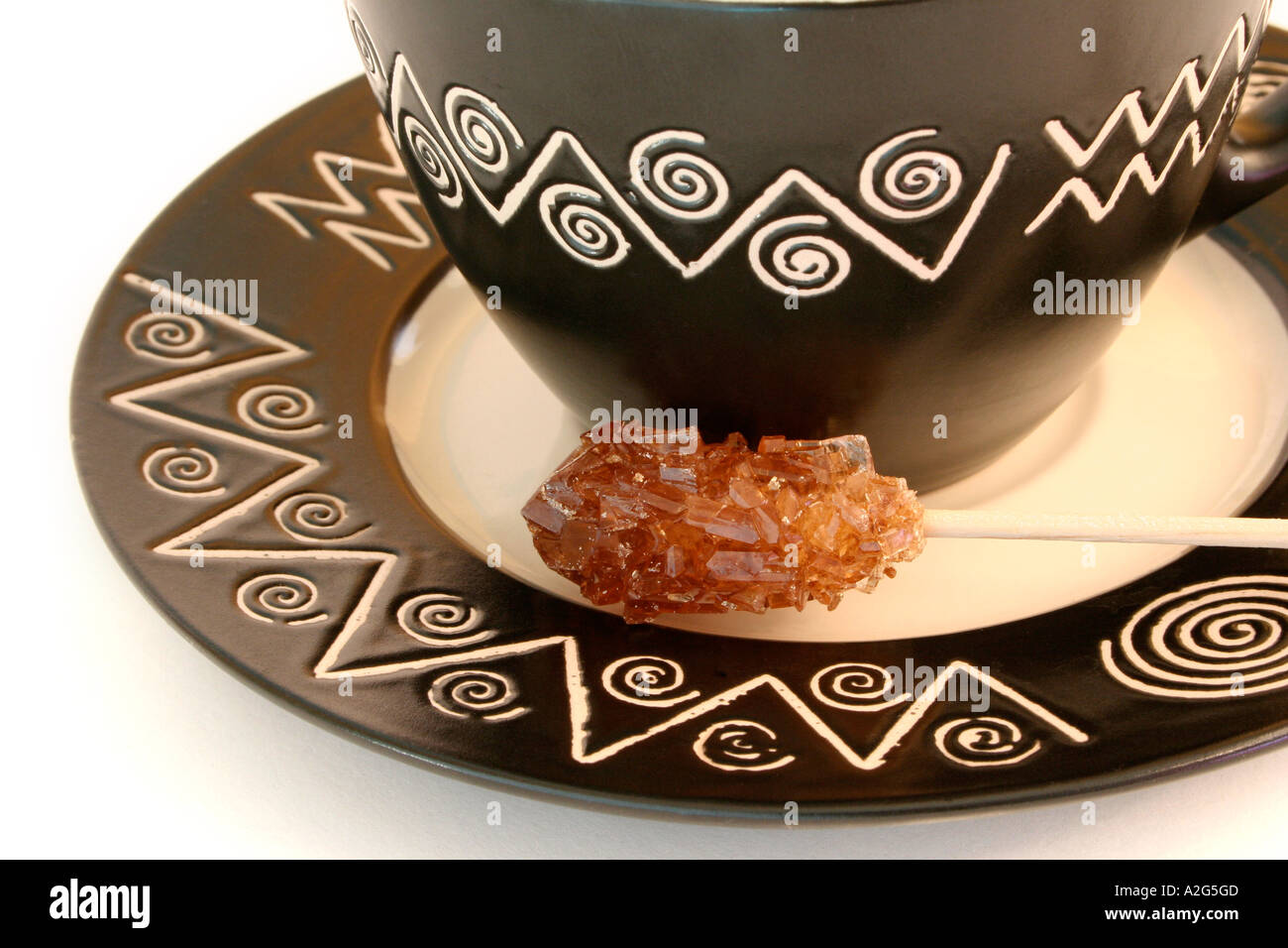 Tea cup with african design and sugar sticks Stock Photo - Alamy