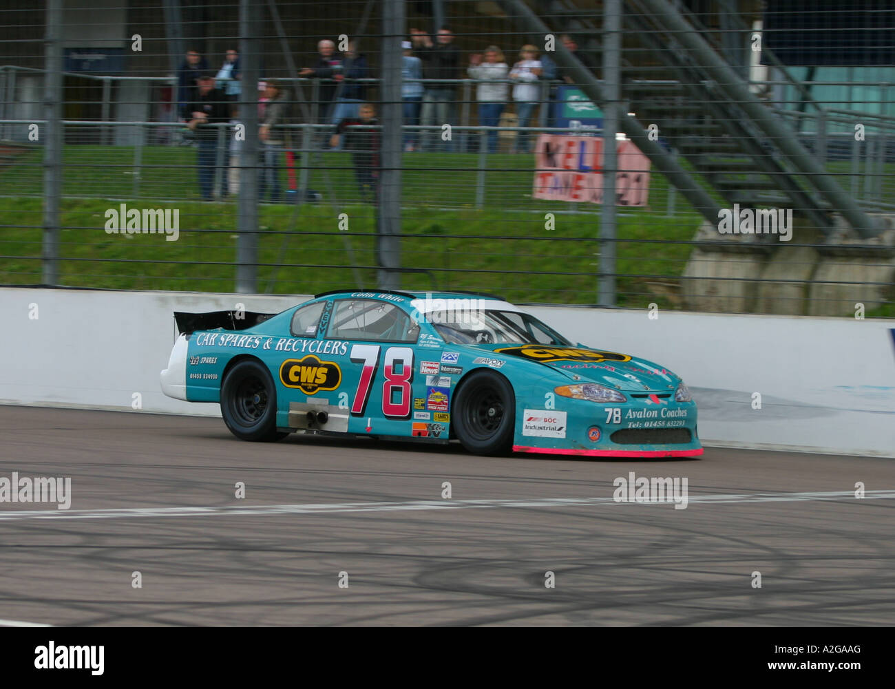 V8 Nascar type stock cars racing on a banked oval circuit Stock Photo ...