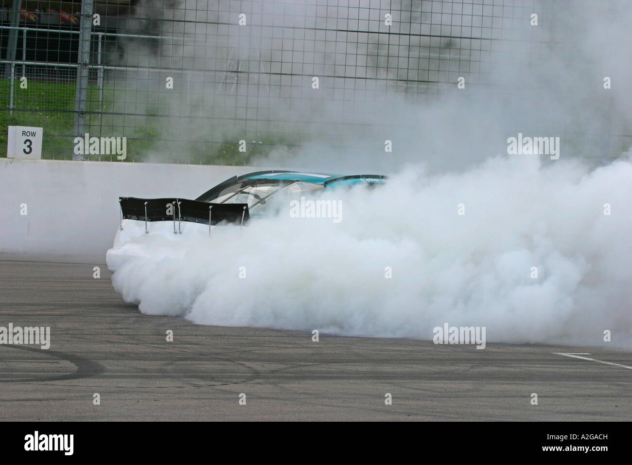 Smoking the tyres in a V8 Nascar stock car Stock Photo - Alamy