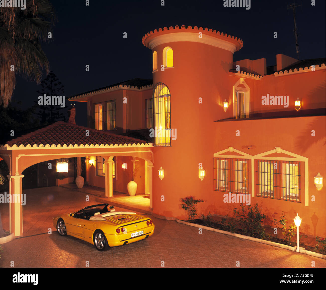 illuminated exterior of spanish villa at night Stock Photo - Alamy