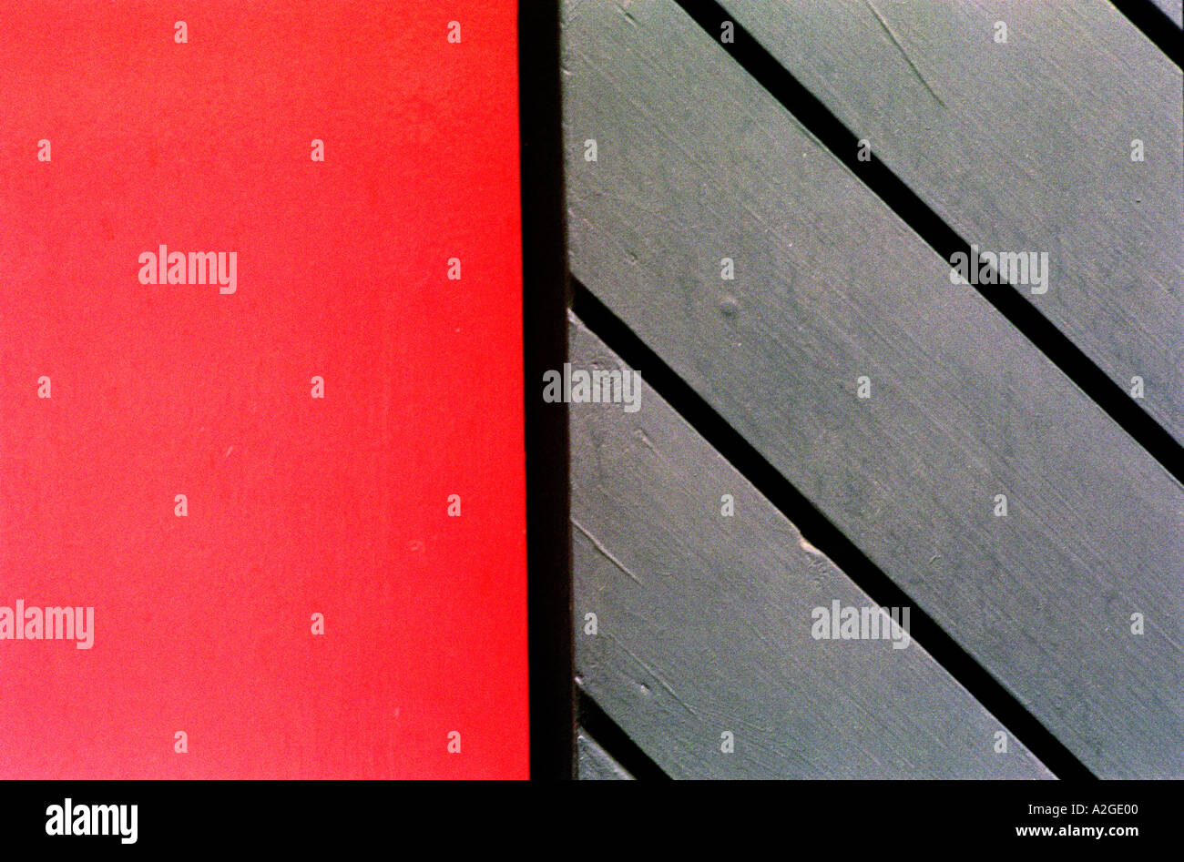 Hoarding, red, gray, in sunshine Stock Photo - Alamy