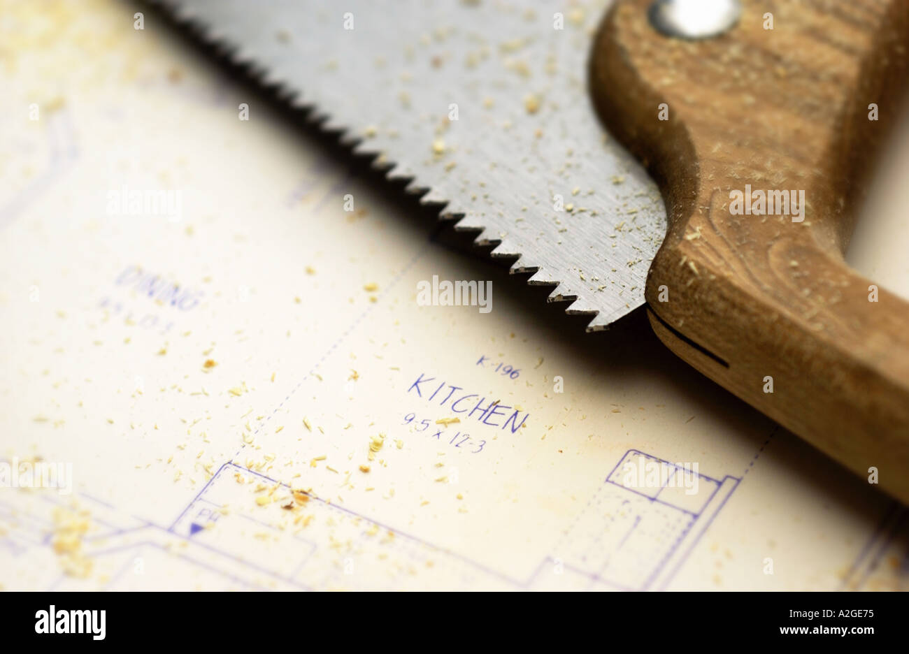 Hand saw lying on blueprints Stock Photo - Alamy