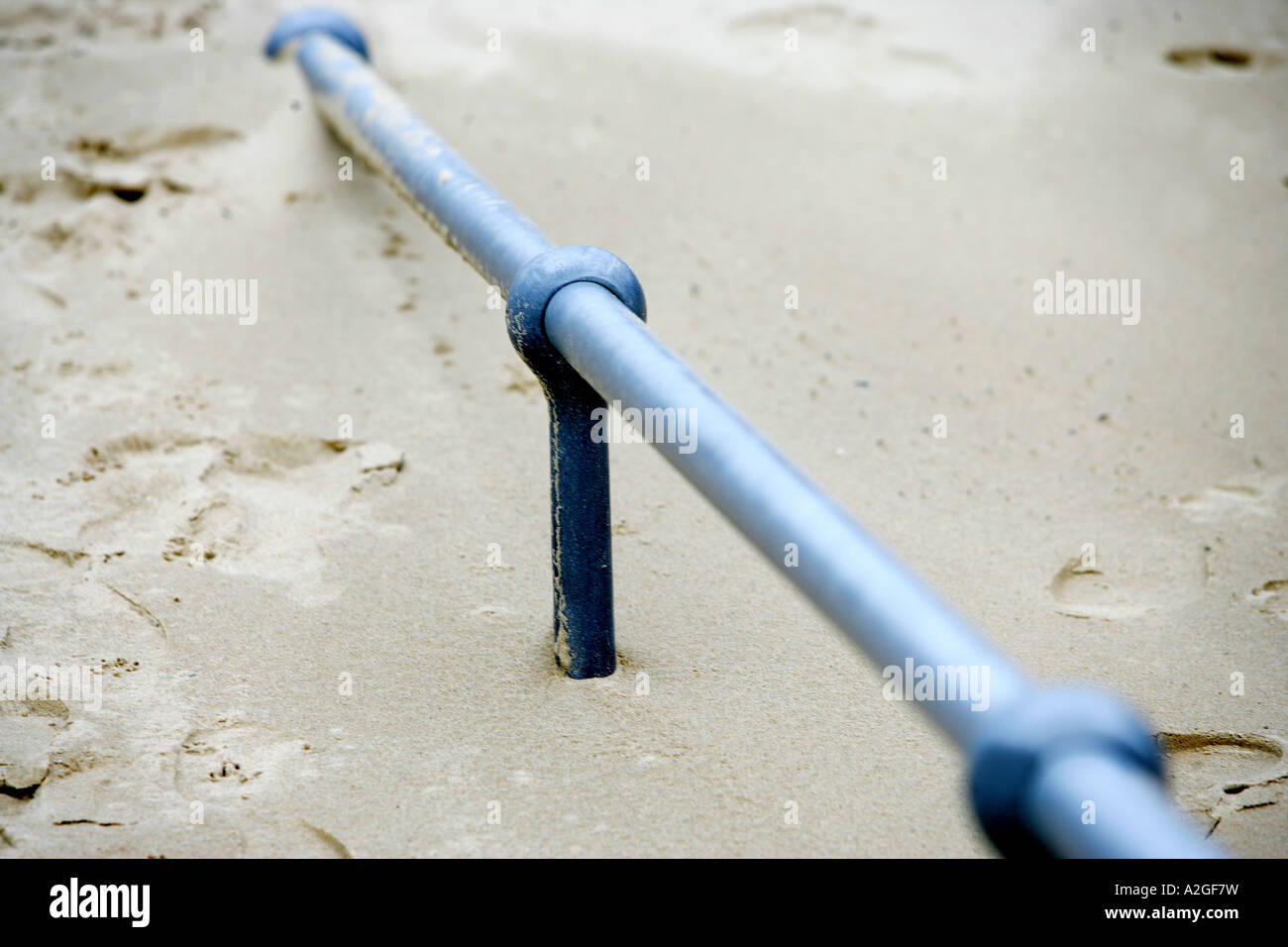 Handrail in the Sand Stock Photo - Alamy