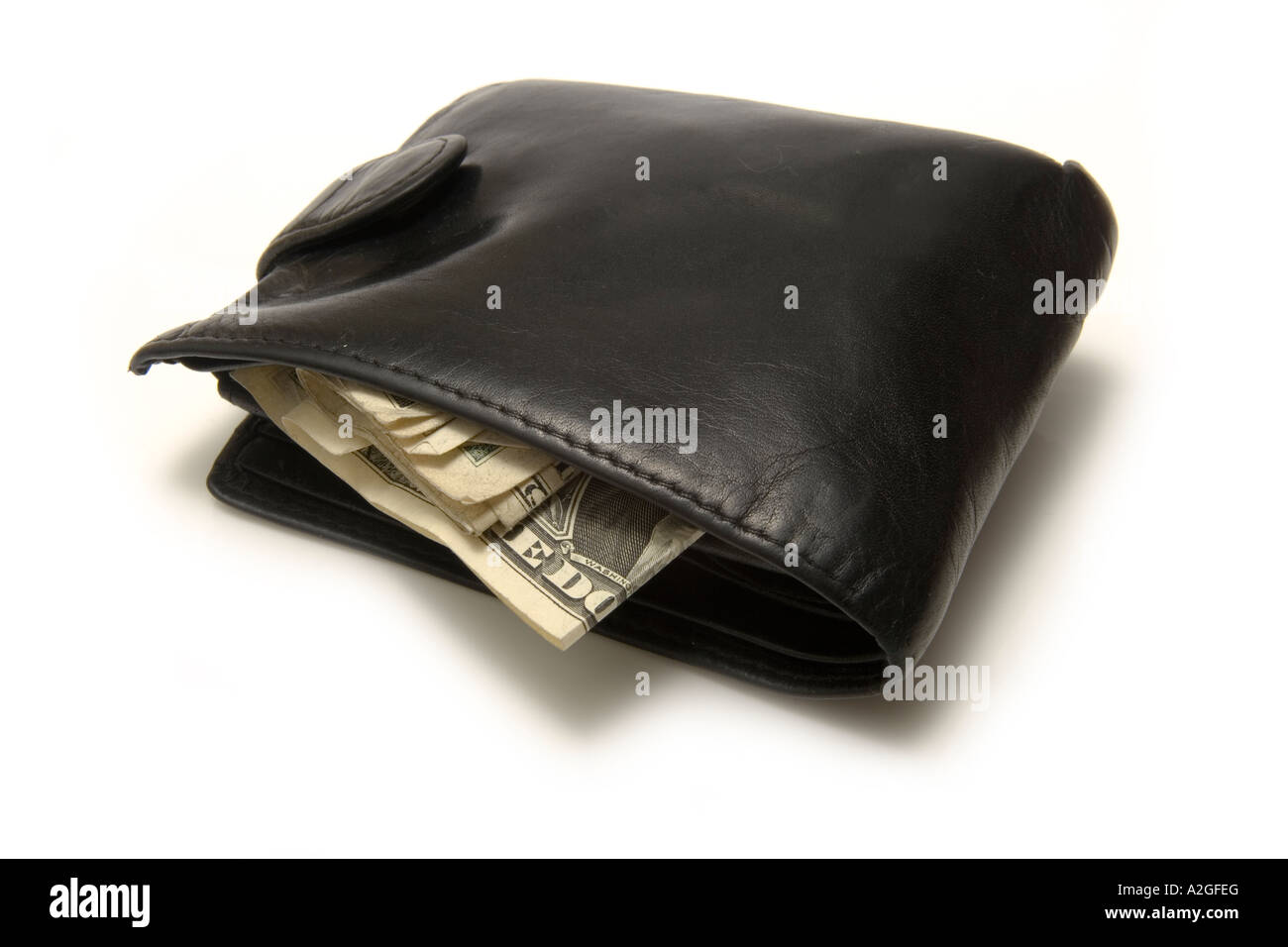 Leather wallet filled with cash isolated on a white studio background ...