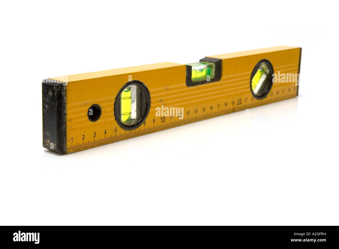 Spirit level isolated on a white studio background Stock Photo - Alamy