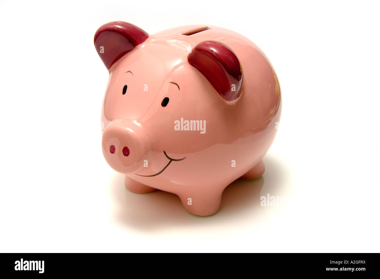 Piggy bank style money box isolated on a white studio background Stock ...