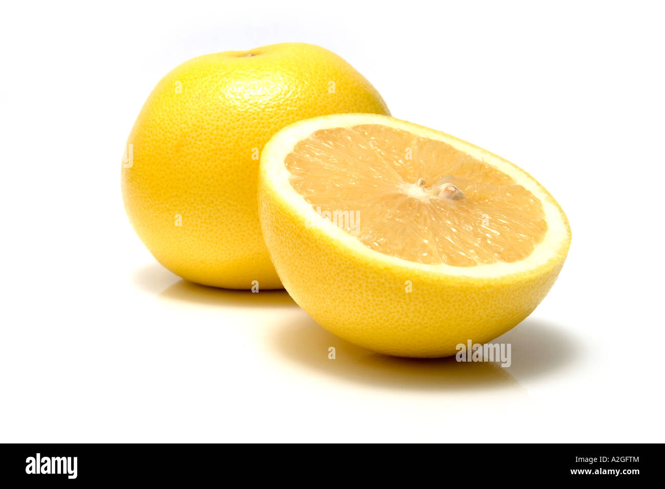 Grapefruit whole and halved isolated on a white studio background Stock ...