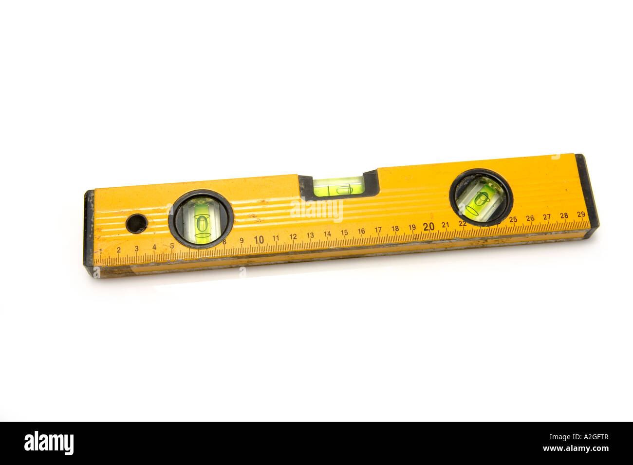 Spirit level isolated on a white studio background Stock Photo - Alamy