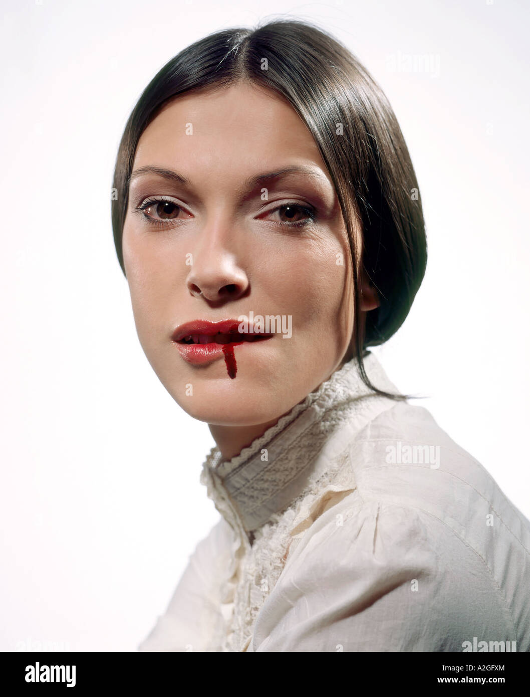 1216624 indoor studio young woman 25 30 brunette hair wisp white blouse ...