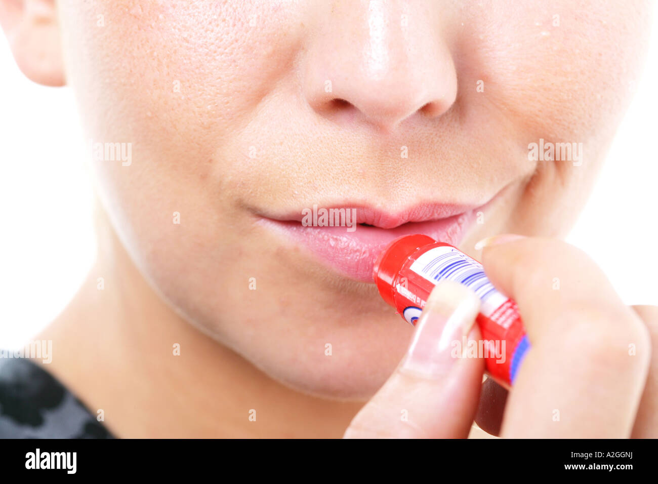 Young Woman Using Lip Balm Model Released Stock Photo - Alamy