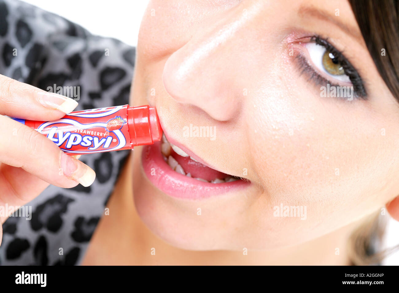 Young Woman Using Lip Balm Model Released Stock Photo - Alamy