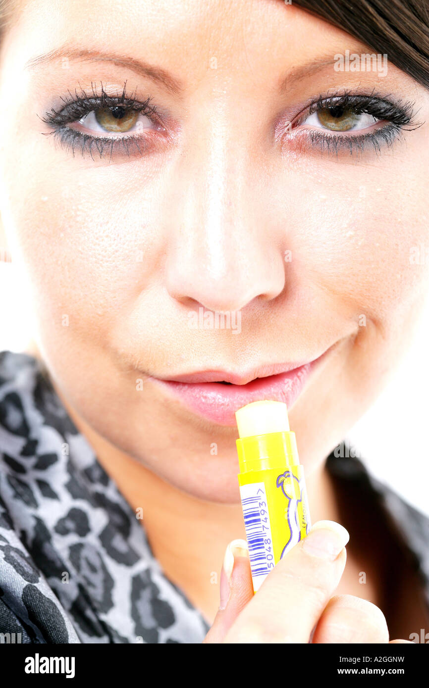 Young Woman Using Lip Balm Model Released Stock Photo - Alamy