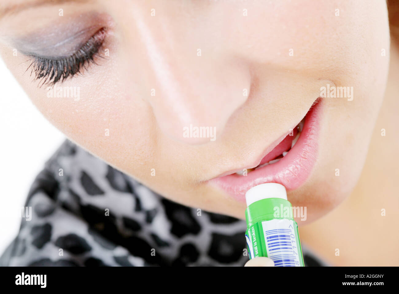 Young Woman Using Lip Balm Model Released Stock Photo - Alamy