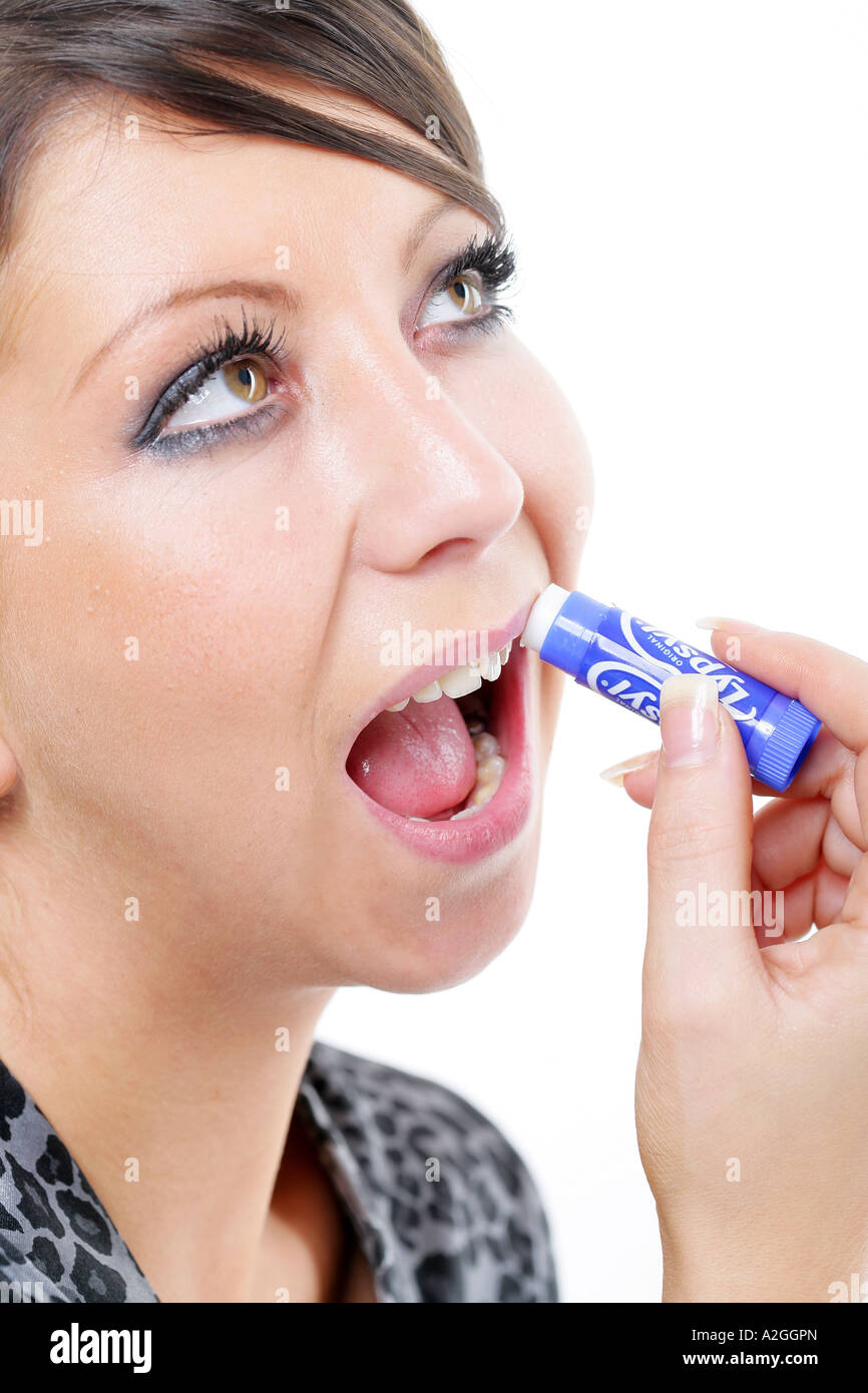Young Woman Using Lip Balm Model Released Stock Photo - Alamy