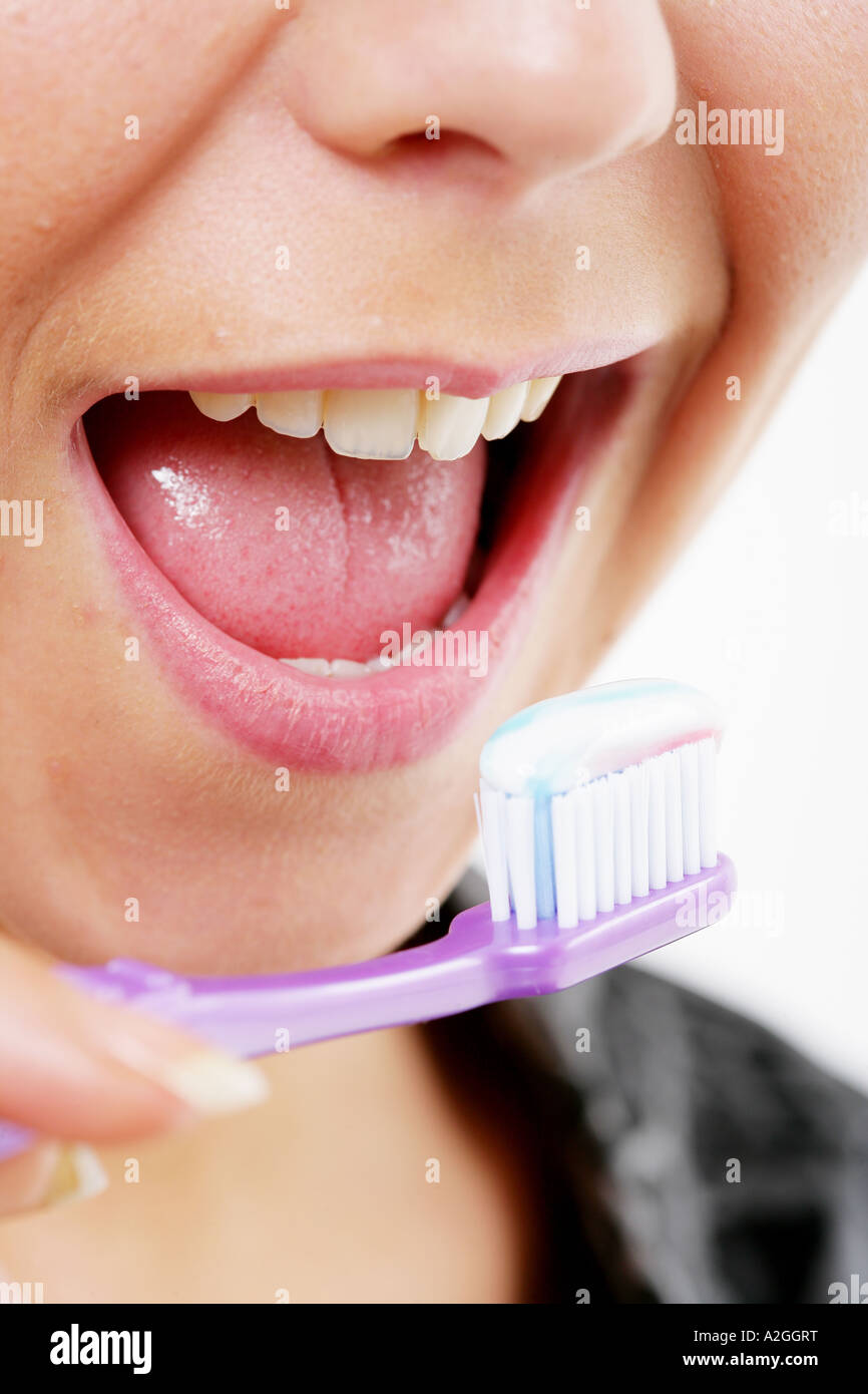 Young Woman Brushing Teeth Model Released Stock Photo - Alamy