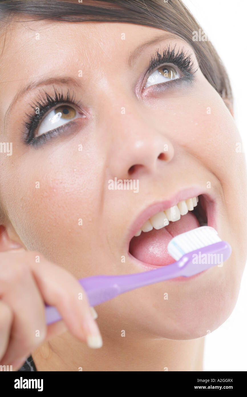 Young Woman Brushing Teeth Model Released Stock Photo - Alamy