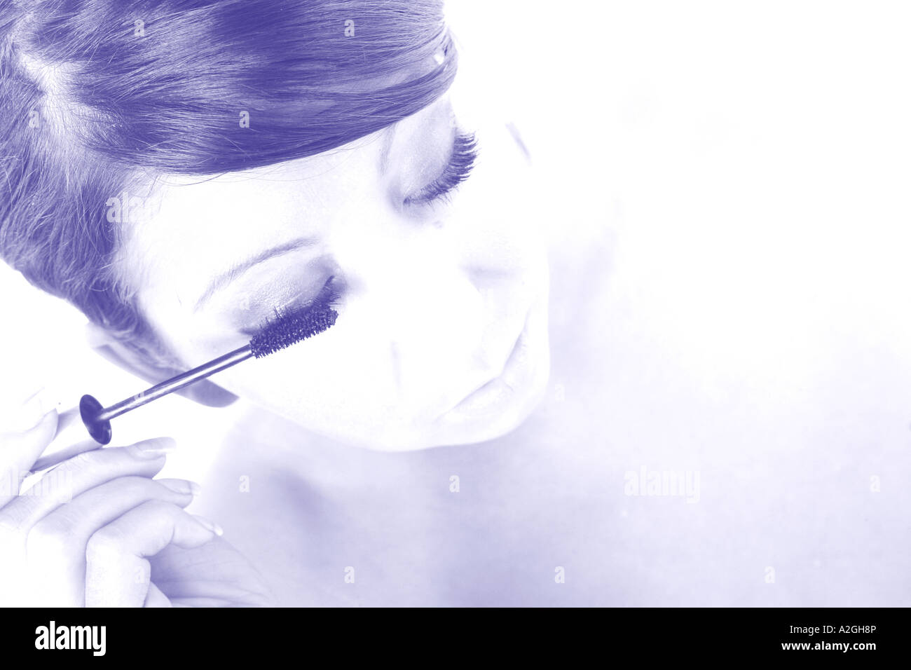 Young Woman Applying Mascara Model Released Stock Photo - Alamy