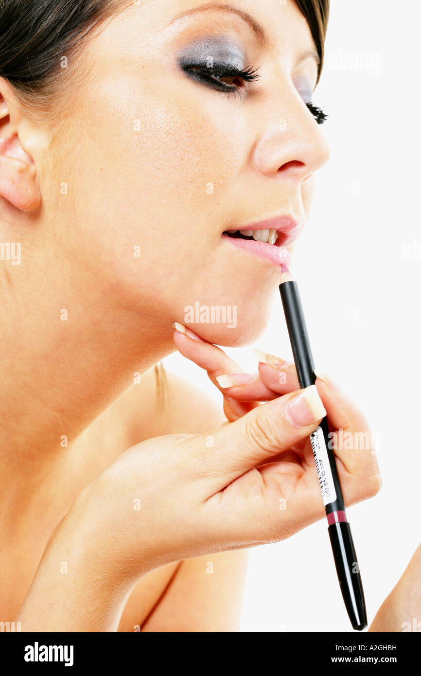 Young Woman Applying Lip Liner Model Released Stock Photo - Alamy