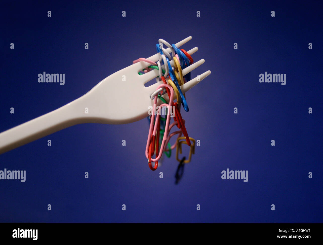 paper clips on plastic fork Stock Photo - Alamy