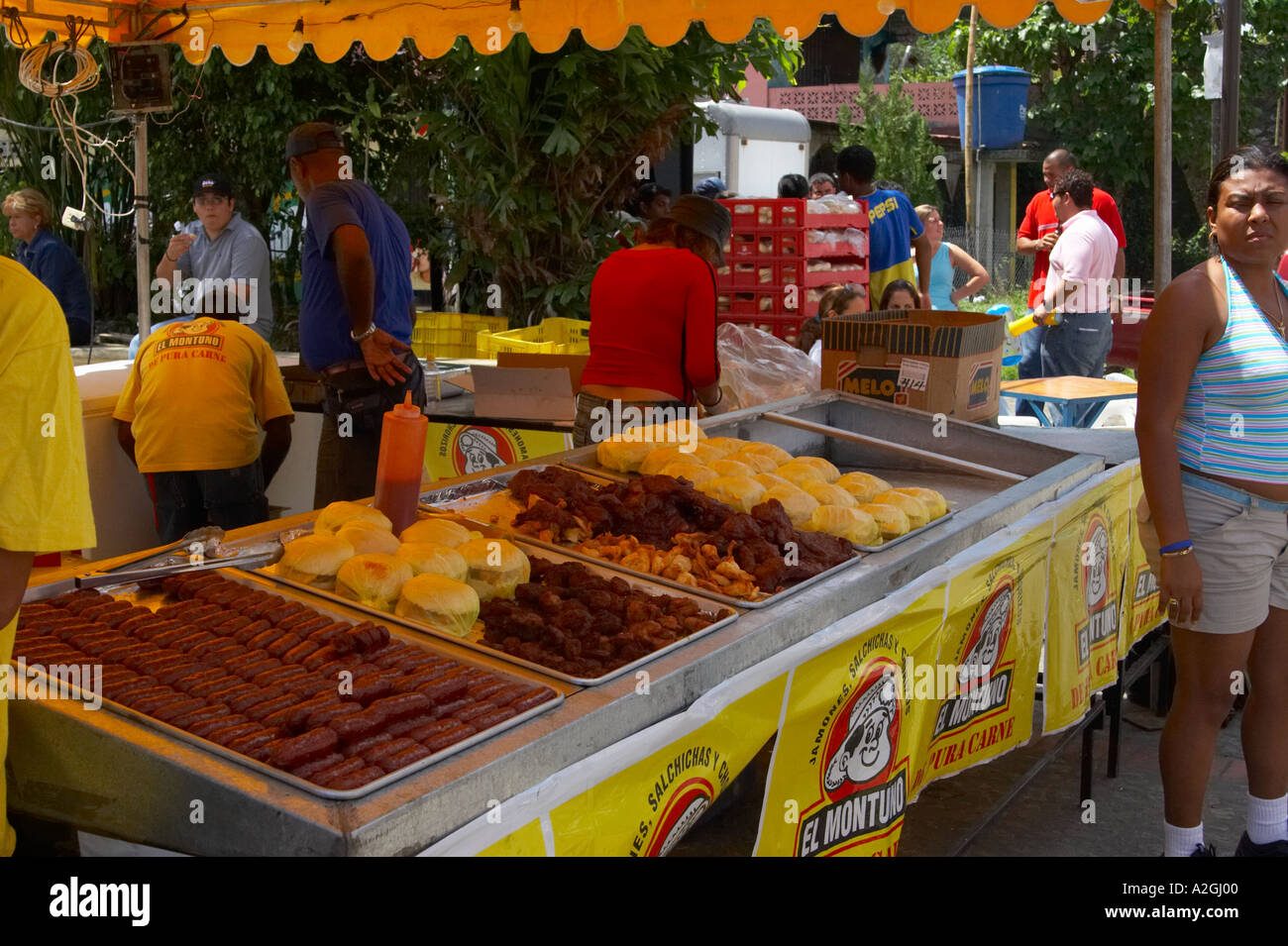 Fast food on the plaza Beneath a tent or awning a group of people sell ...