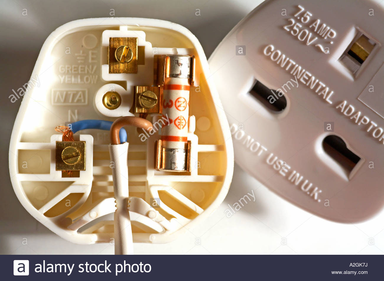 Uk 3 pin plug and continental adaptor Stock Photo - Alamy