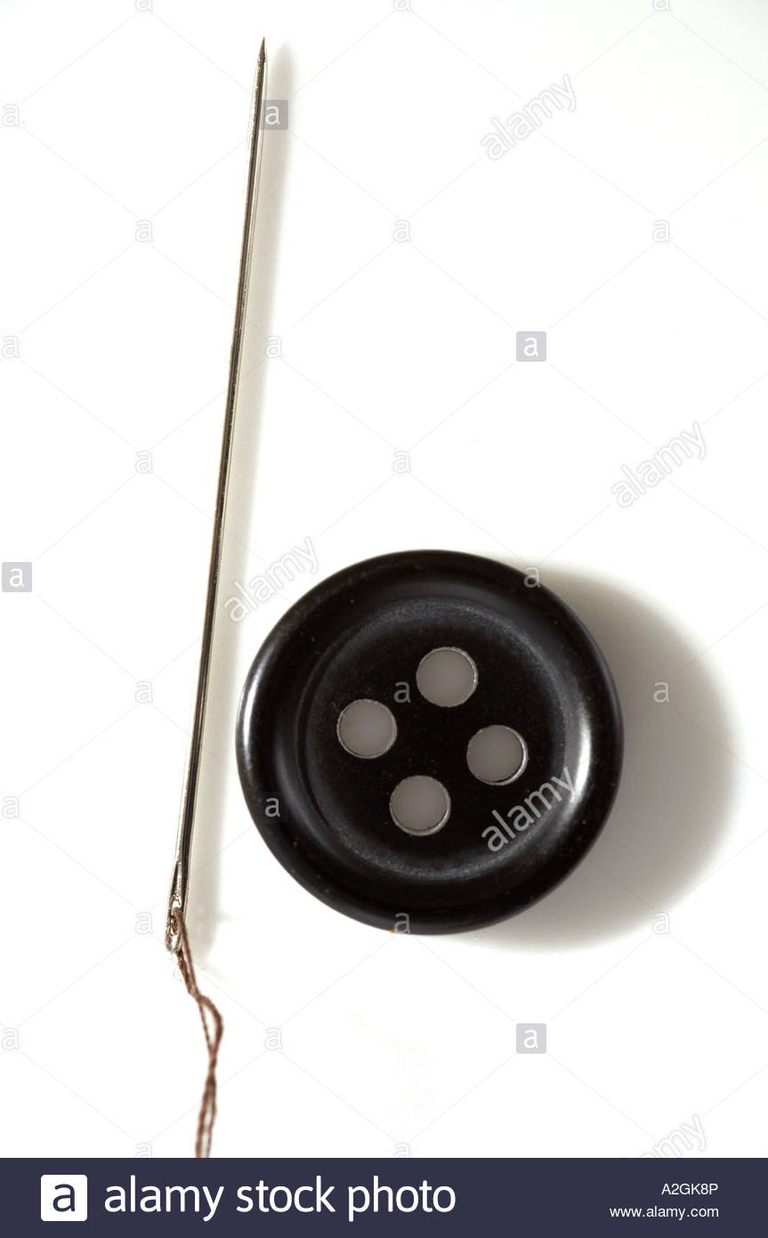 Button, needle and thread Stock Photo - Alamy