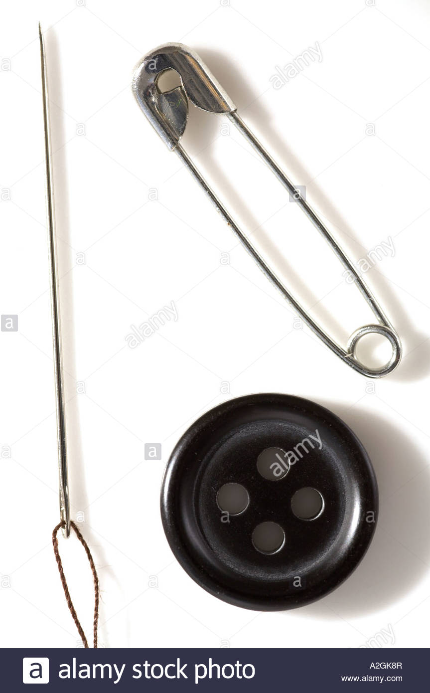 Button, needle, thread and safety pin Stock Photo - Alamy