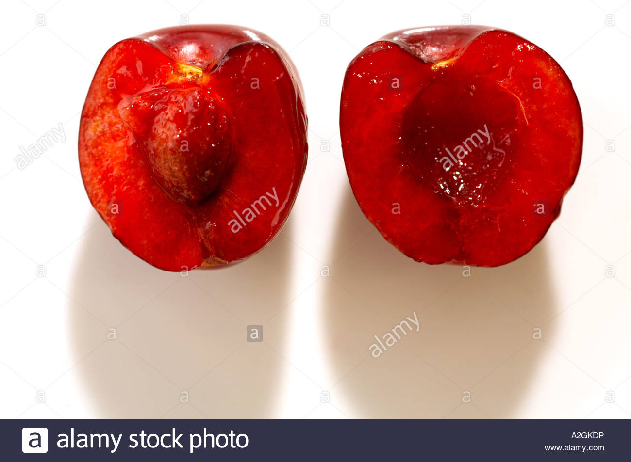 Sliced red cherry Stock Photo - Alamy