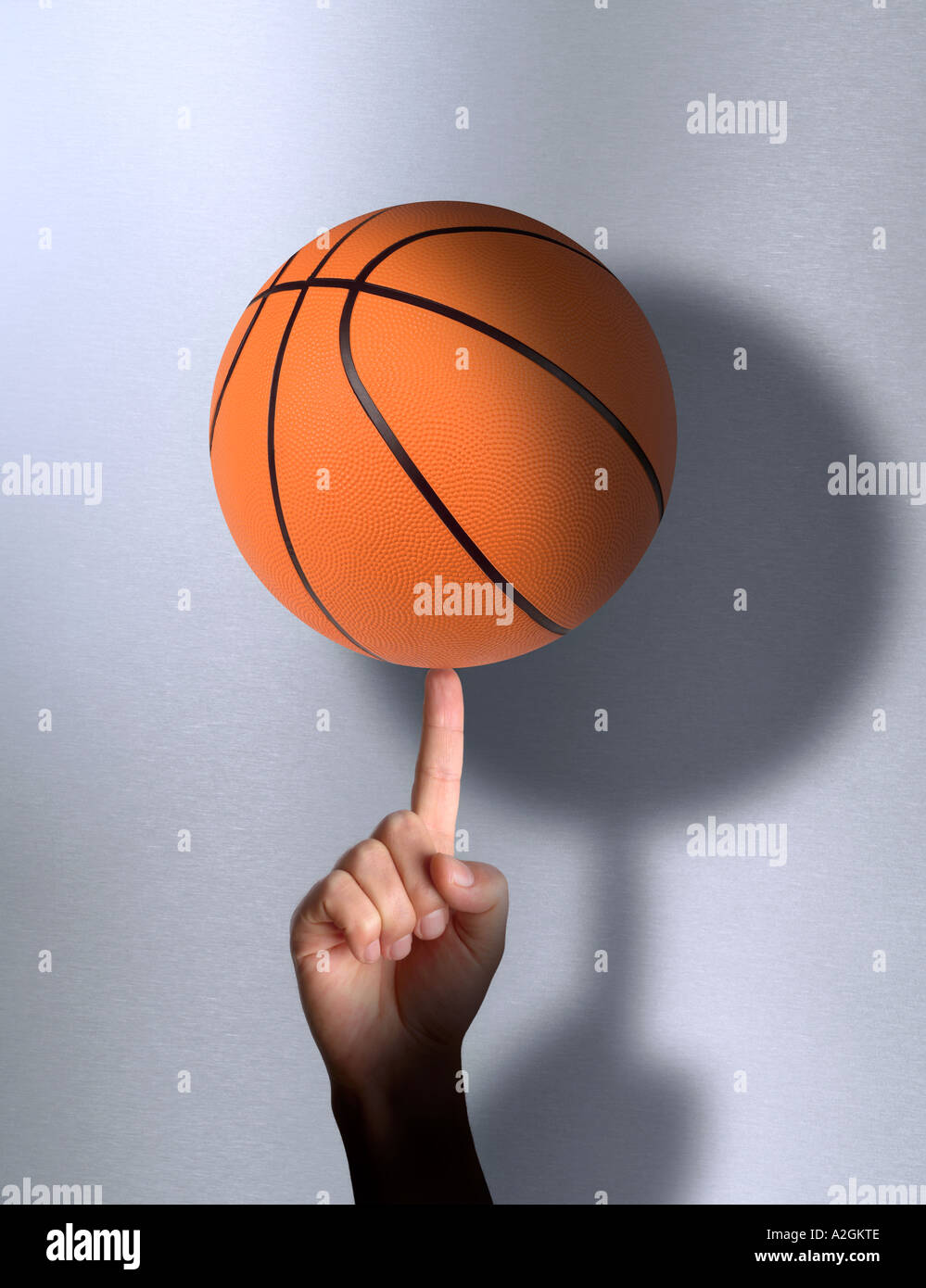 Basketball on the fingertip Stock Photo - Alamy