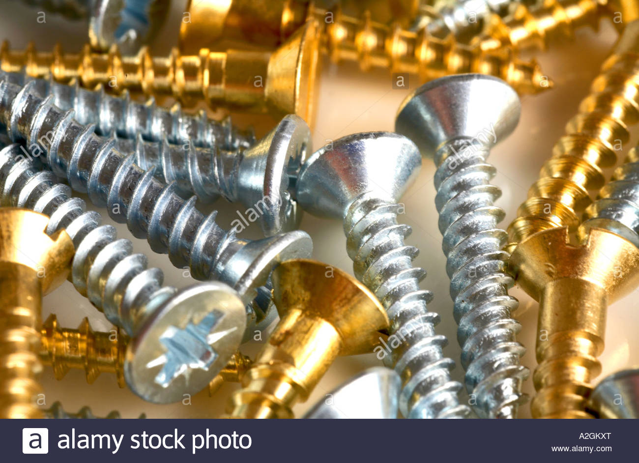 Brass and silver screws Stock Photo - Alamy