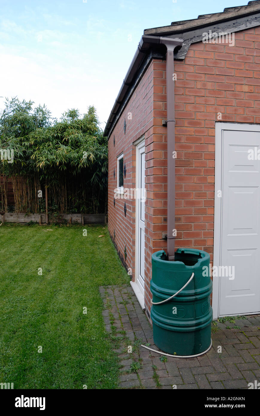 Water collection from garage roof and gutter Stock Photo - Alamy