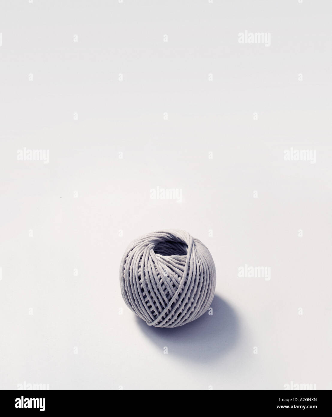 Ball of string on a white background Stock Photo - Alamy
