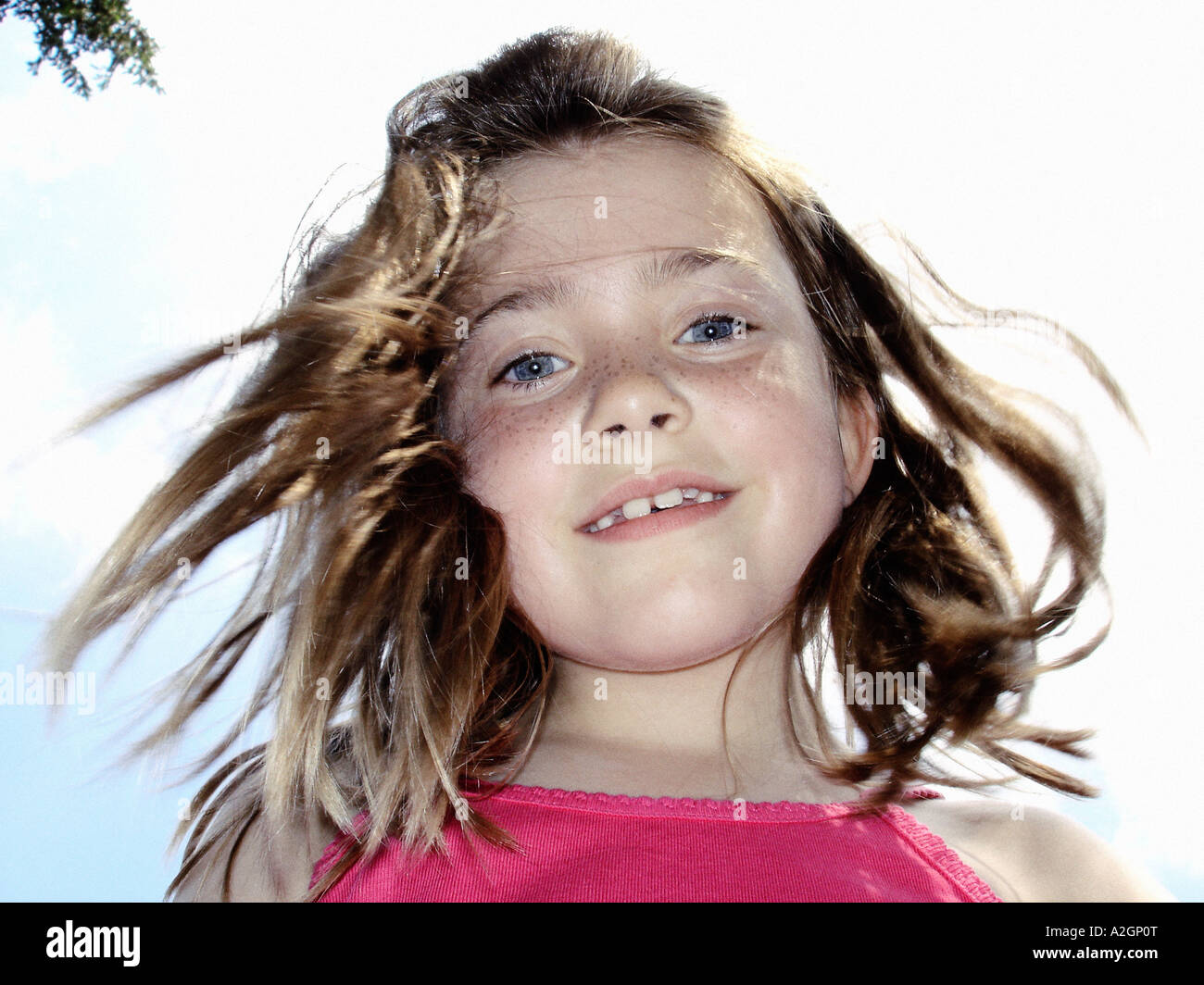 Portrait of a girl looking down onto a camera lens Stock Photo - Alamy