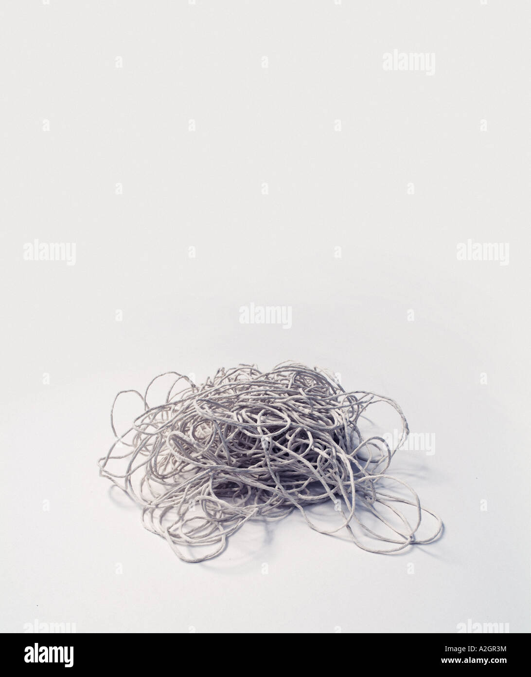 Pile of string on a white background Stock Photo - Alamy