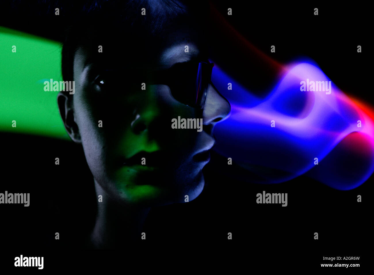 Two faces joined together with an electric light show Stock Photo - Alamy