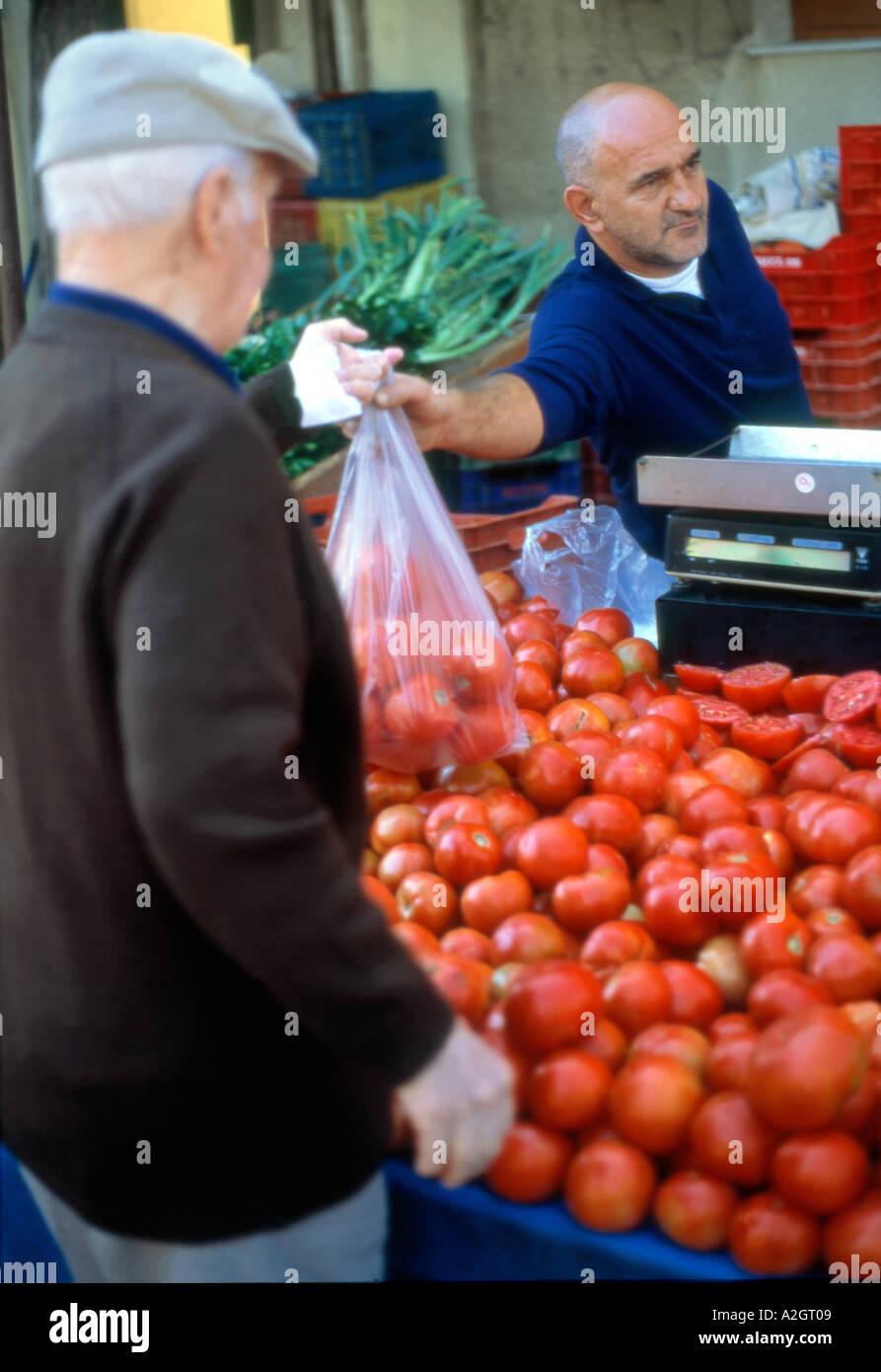 Fruit salesman at the local outddor fruit and vegetable market Athens ...