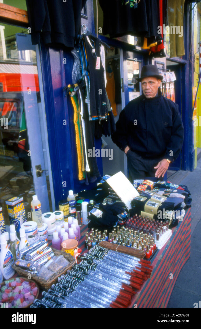 Shopkeeper outside his shop Portobello Road Notting Hill London England ...