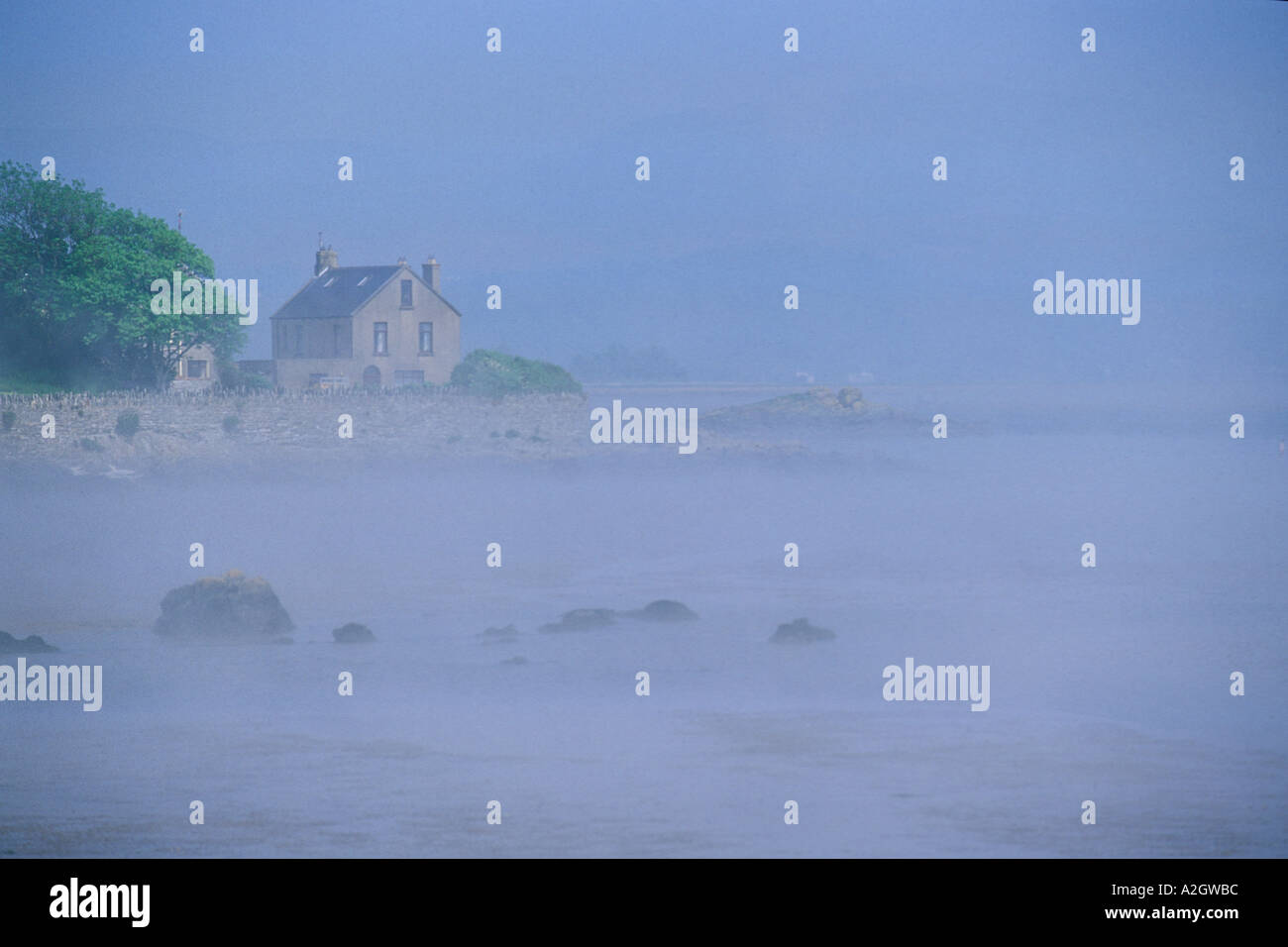 Ireland, County Louth, House and coastal fog Stock Photo - Alamy