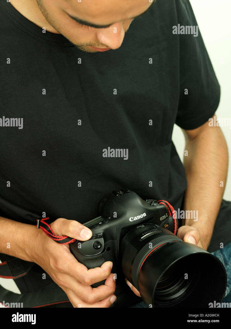 Young Man holding Camera Model Released Stock Photo - Alamy