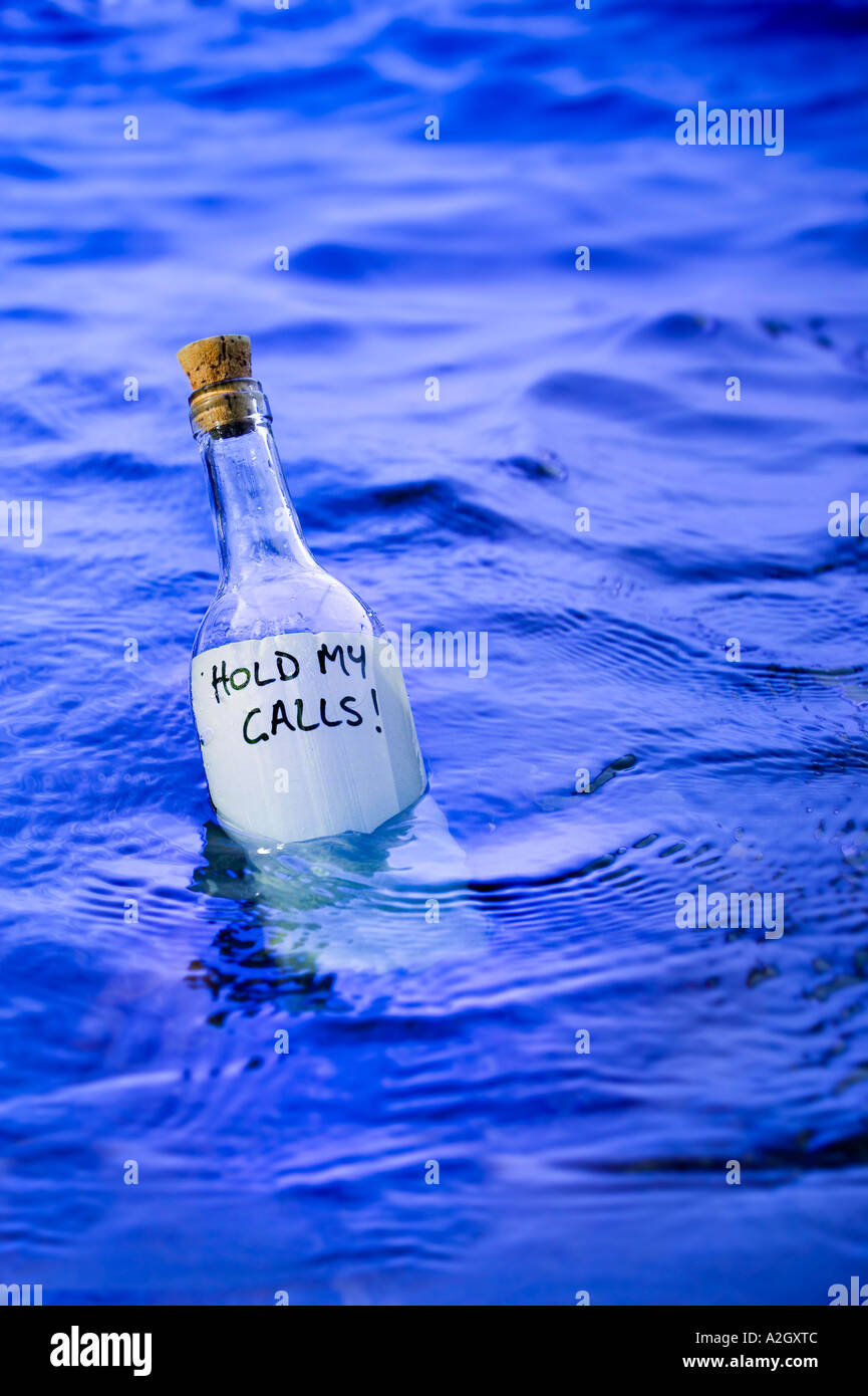 message in a floating bottle saying 'hold my calls' Stock Photo - Alamy