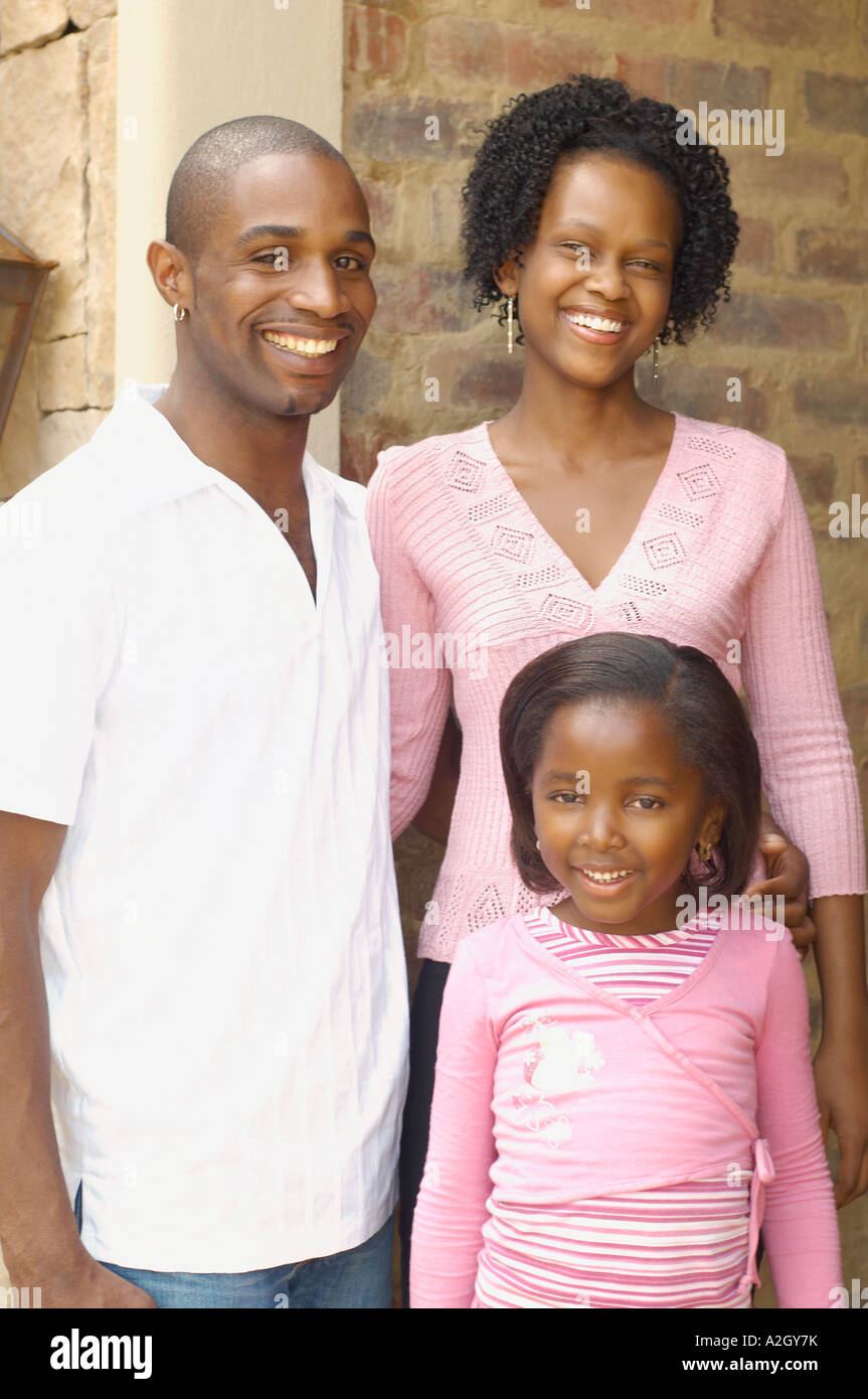 Young African parents with daughter smiling Stock Photo - Alamy