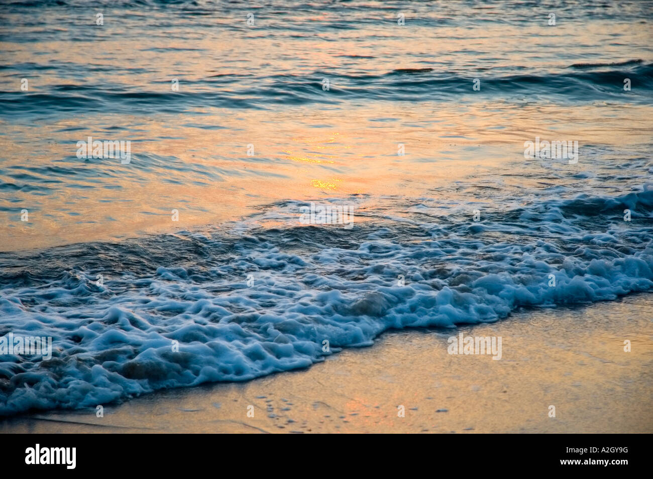 Indonesia Bali Kuta Beach sunset waves on beach Stock Photo - Alamy