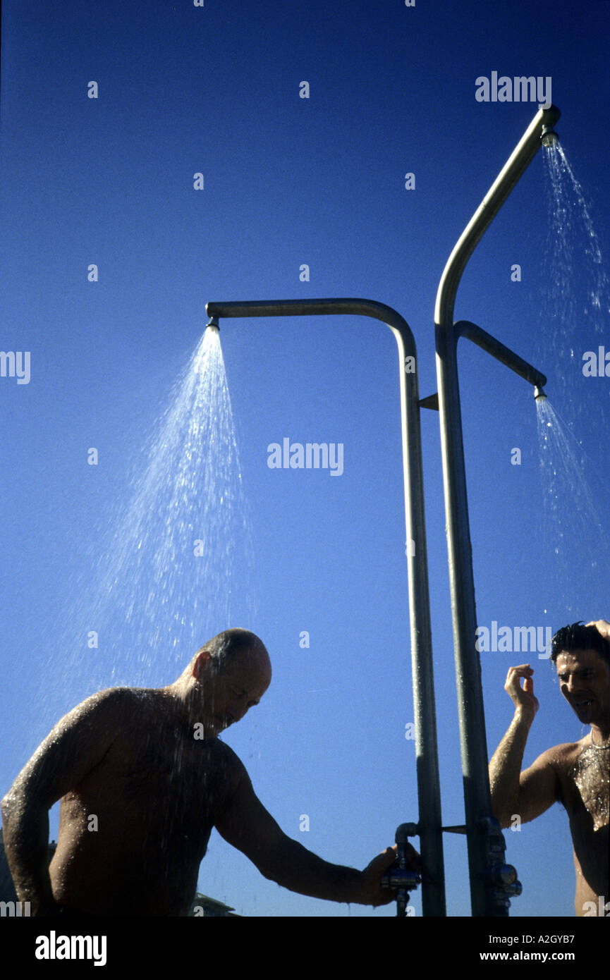 bathers under shower on the beach Antibes france Stock Photo - Alamy