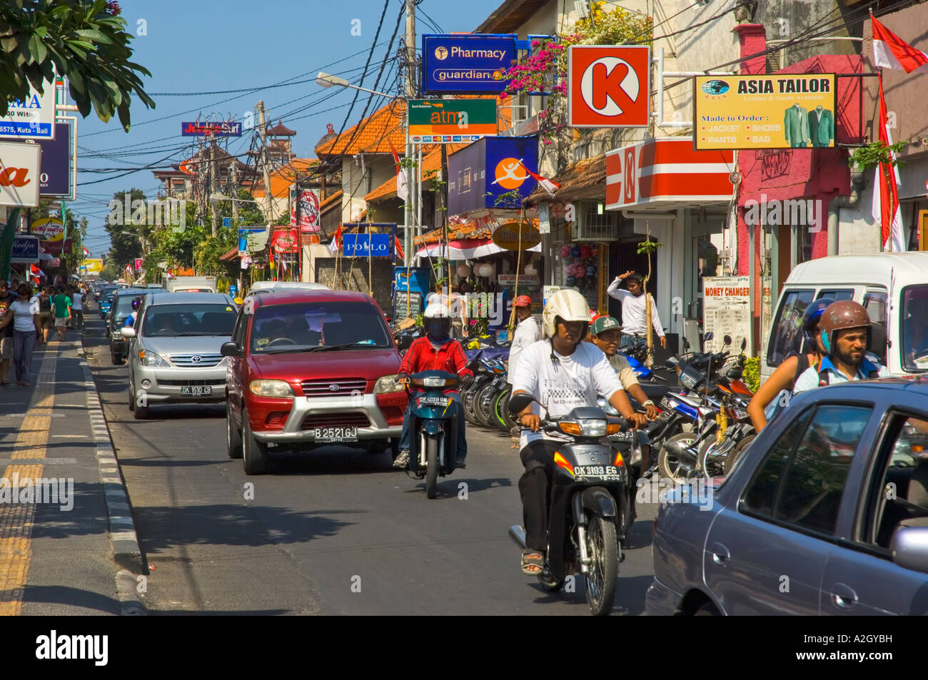 Indonesia Bali Kuta traffic on Kuta Beach Road cars motorcycles ...