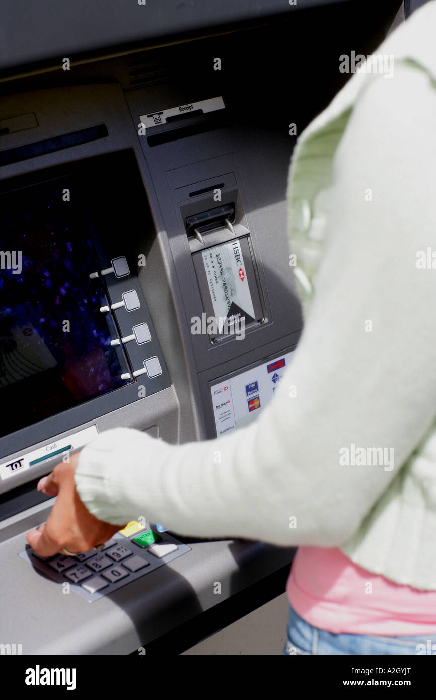Taking money out of an atm hi-res stock photography and images - Alamy