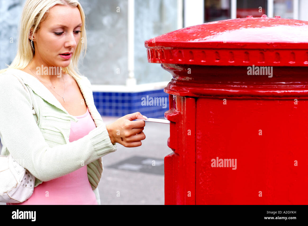 Young Woman at Post Box Model Released Stock Photo - Alamy