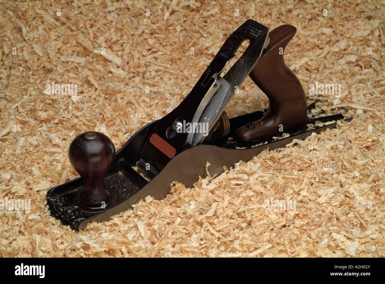 Carpenters Plane on Wood Shavings Stock Photo - Alamy