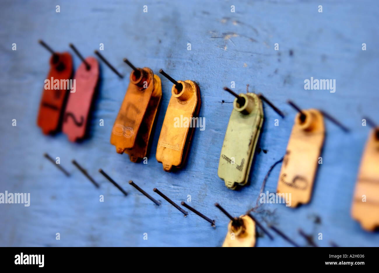 Hanging tags in factory setting Stock Photo - Alamy